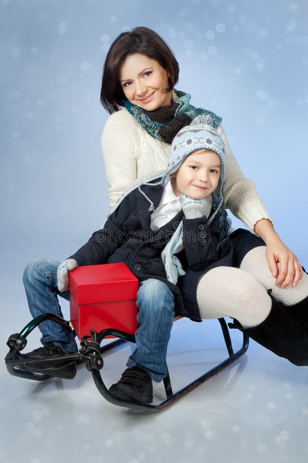 Happy Family Sitting on a Sled at Winter Time Stock Image - Image of ...