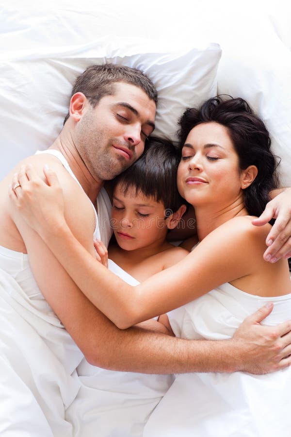 Happy Family Sleeping Together Stock Photo - Image of family, people ...