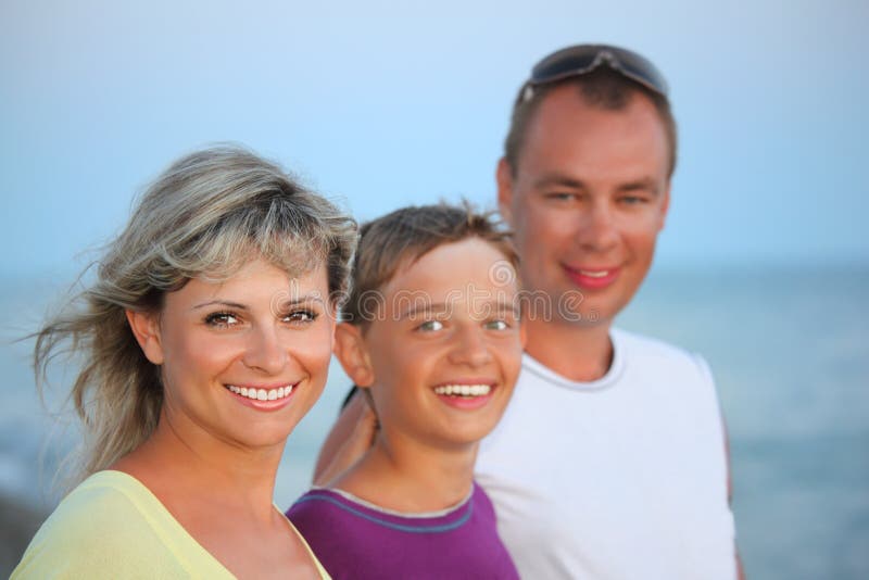 Smiling family on beach. stock image. Image of leisure - 2046159