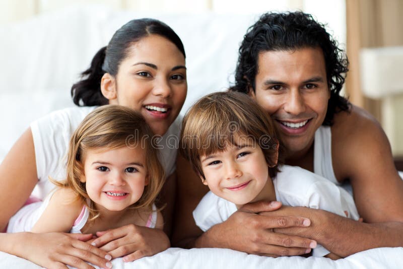Happy Family Smiling at the Camera Stock Image - Image of morning, play ...