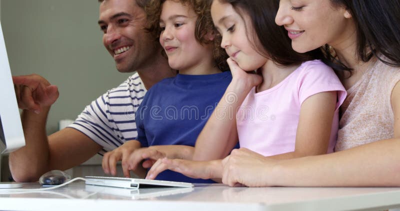Happy Family Smiling and Using a Computer Together Stock Video - Video ...