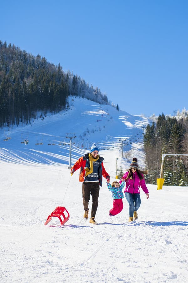 Happy Family in Snow Riding on Sledge. Stock Image - Image of company ...