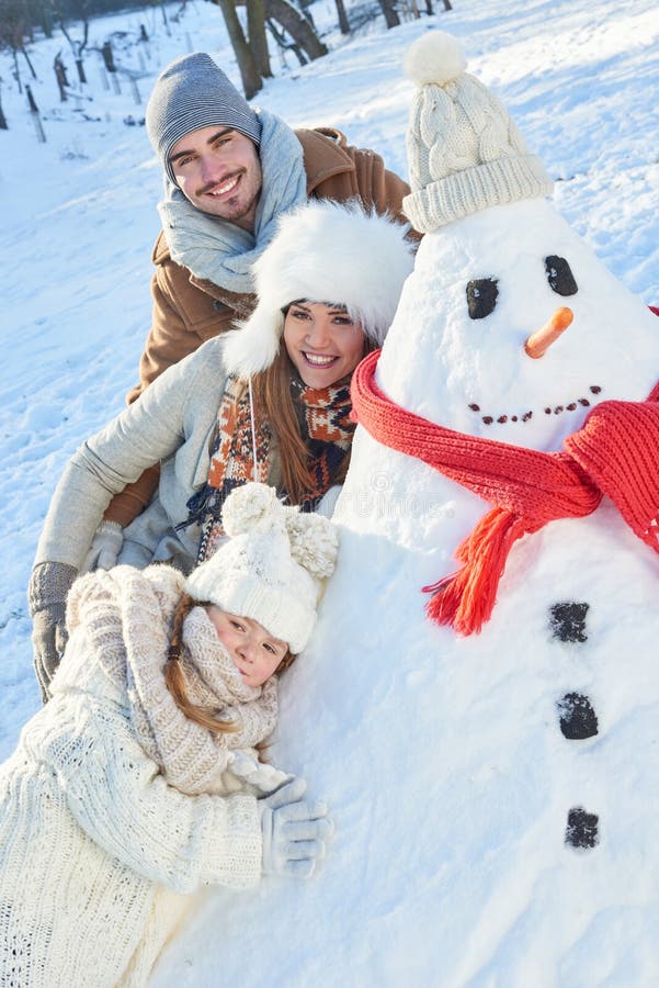 Happy Family with Snowman in Winter Stock Image - Image of people ...