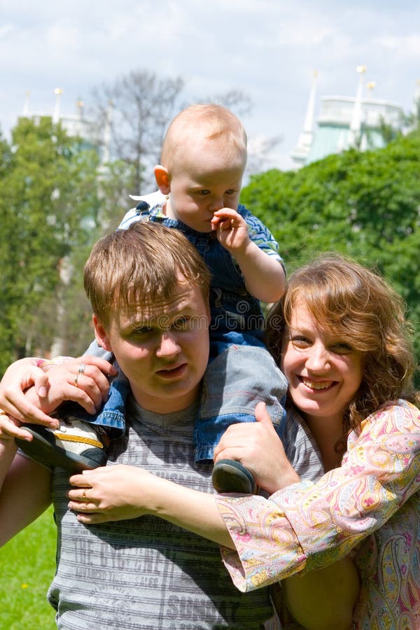 Happy family with son stock photo. Image of park, grass - 13512912