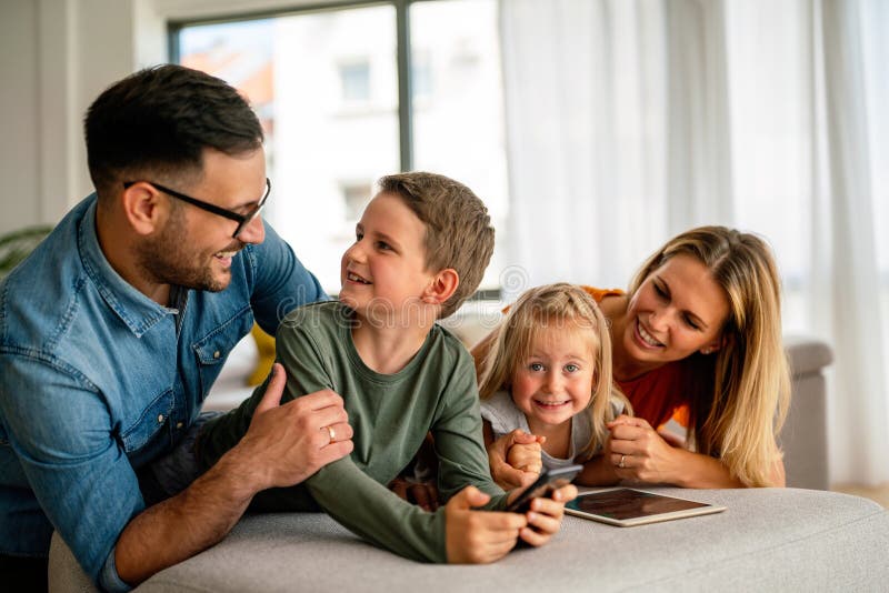 Happy Family Spending Time at Home with Digital Devices Together ...