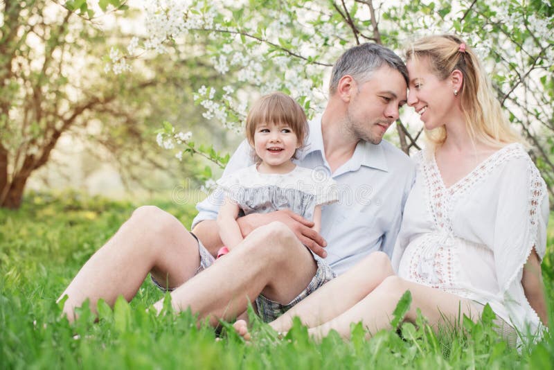 Happy Family on Spring Garden Stock Photo - Image of male, lifestyle ...