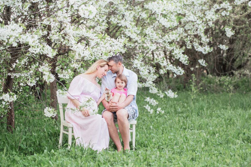 Happy Family on Spring Garden Stock Photo - Image of father, cherry ...