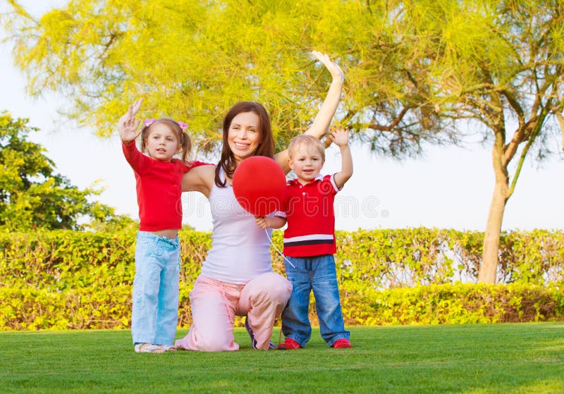 Happy Family In Spring Park Stock Photo - Image of adult, hands: 29671692