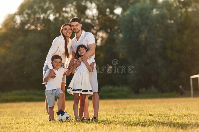 Happy Family is Standing Together on the Field Stock Illustration ...