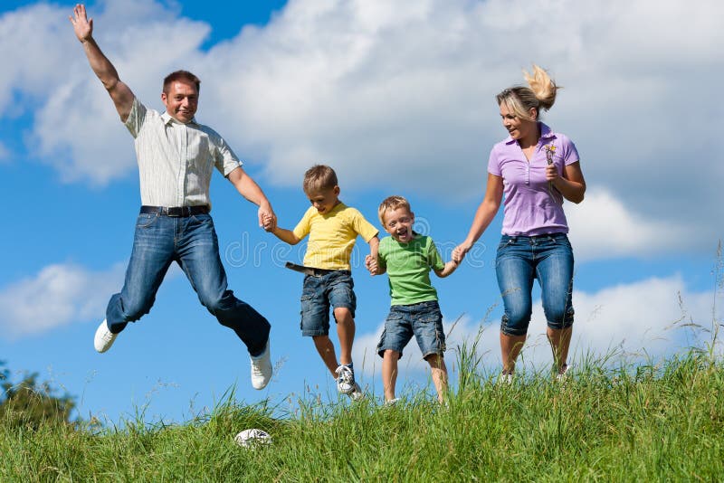 Happy Active Family Jumping Stock Image - Image of outdoors, fitness ...