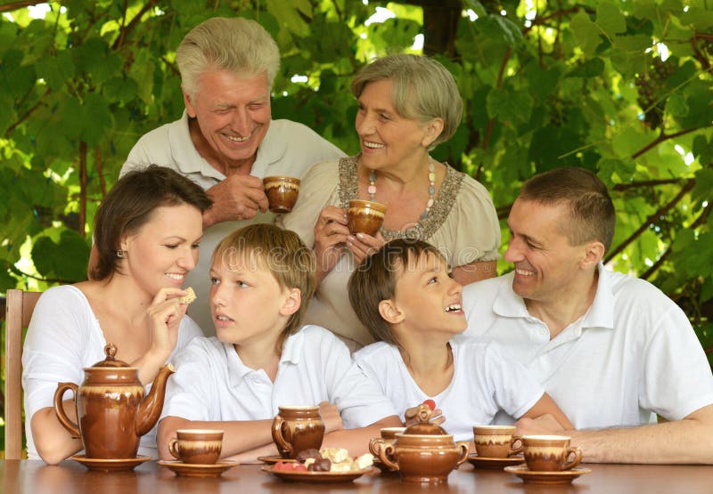 Family on Street Curb Watch Parade Stock Image - Image of parental ...