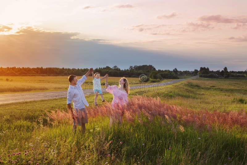 Happy family at sunset stock image. Image of father, mother - 96724299