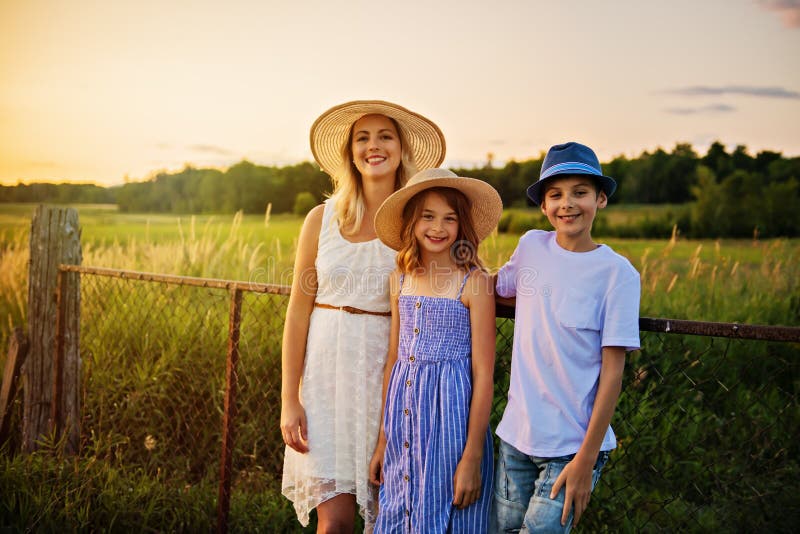 Happy Family at Sunset. they Having Fun and Playing in Nature at Sunset ...