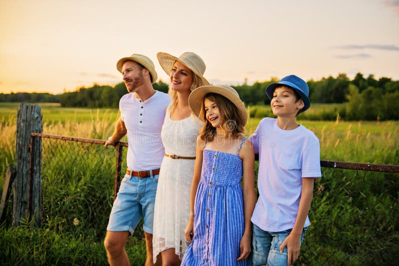 Happy Family at Sunset. they Having Fun and Playing in Nature at Sunset ...
