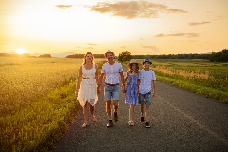 Happy Family at Sunset. they Having Fun and Playing in Nature at Sunset ...
