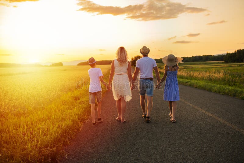 Happy Family at Sunset. they Having Fun and Playing in Nature at Sunset ...