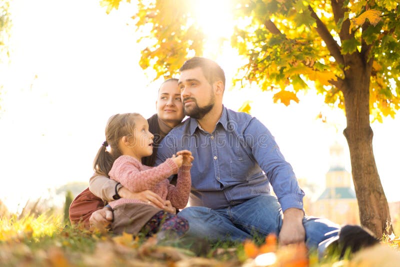 Happy Family at Sunset Walking in the Park in Autumn Stock Image ...