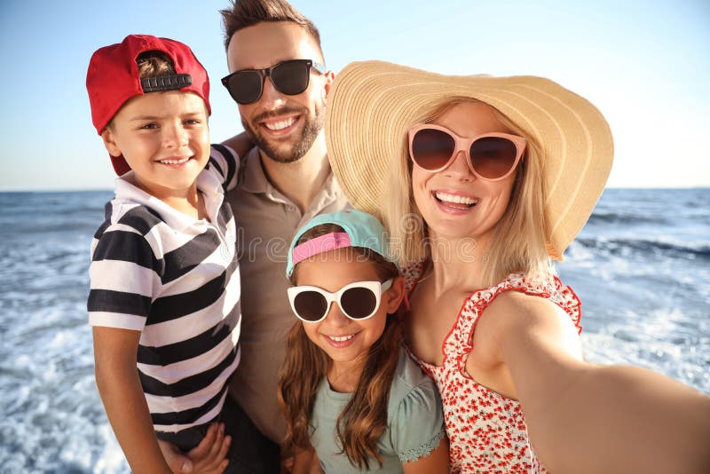 Happy Family Taking Selfie on Beach Near Sea. Summer Vacation Stock ... Happy Family Taking Selfie on Beach Near Sea. Summer Vacation Stock ...