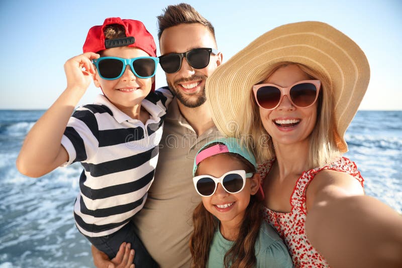 Happy Family Taking Selfie on Beach Near Sea. Summer Vacation Stock ... Happy Family Taking Selfie on Beach Near Sea. Summer Vacation Stock ...