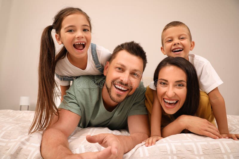 Happy Family Taking Selfie on Bed at Home Stock Image - Image of adult ... Happy Family Taking Selfie on Bed at Home Stock Image - Image of adult ...
