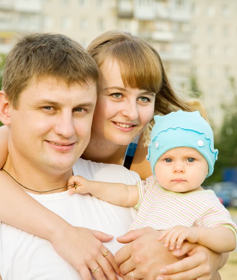 Happy family of three stock image. Image of city, male - 17626807