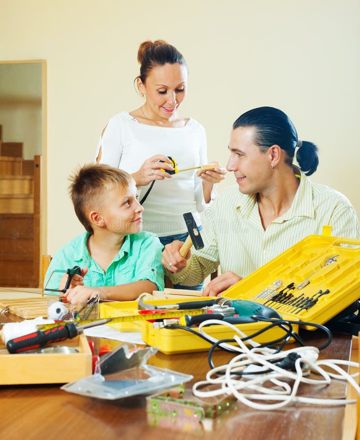 Happy Family Three Doing Something Tools Stock Photos - Free & Royalty ...