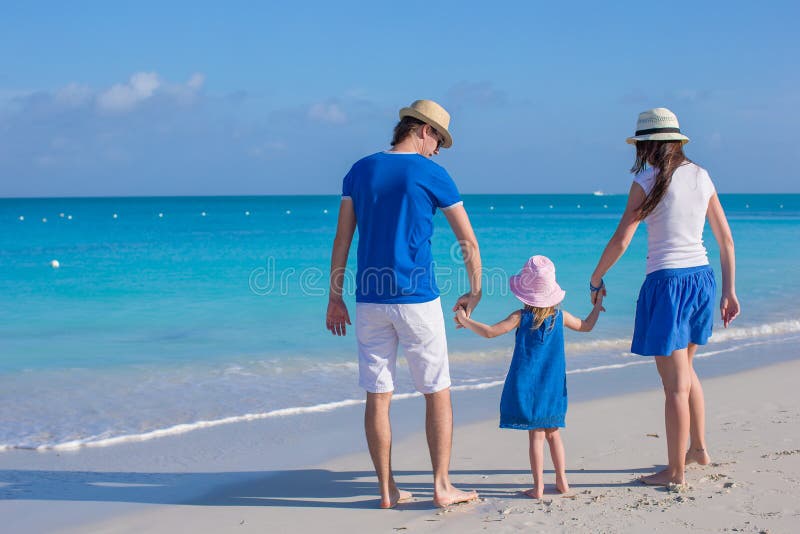 Happy Family of Three Enjoying Beach Vacation Stock Image - Image of ...