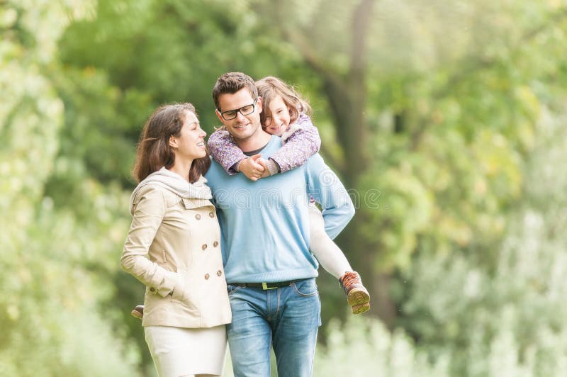 Happy Family of Three Having Fun Outdoor. Stock Image - Image of group ...