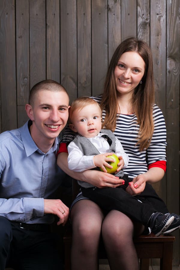 Happy Family of Three in Studio Background Stock Image - Image of ...