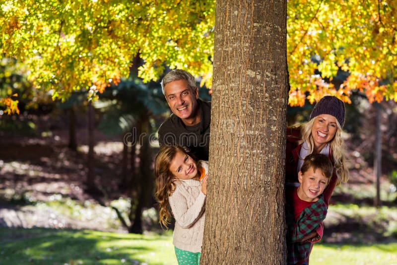 Happy Family by Tree at Park Stock Image - Image of lifestyles, leisure ...