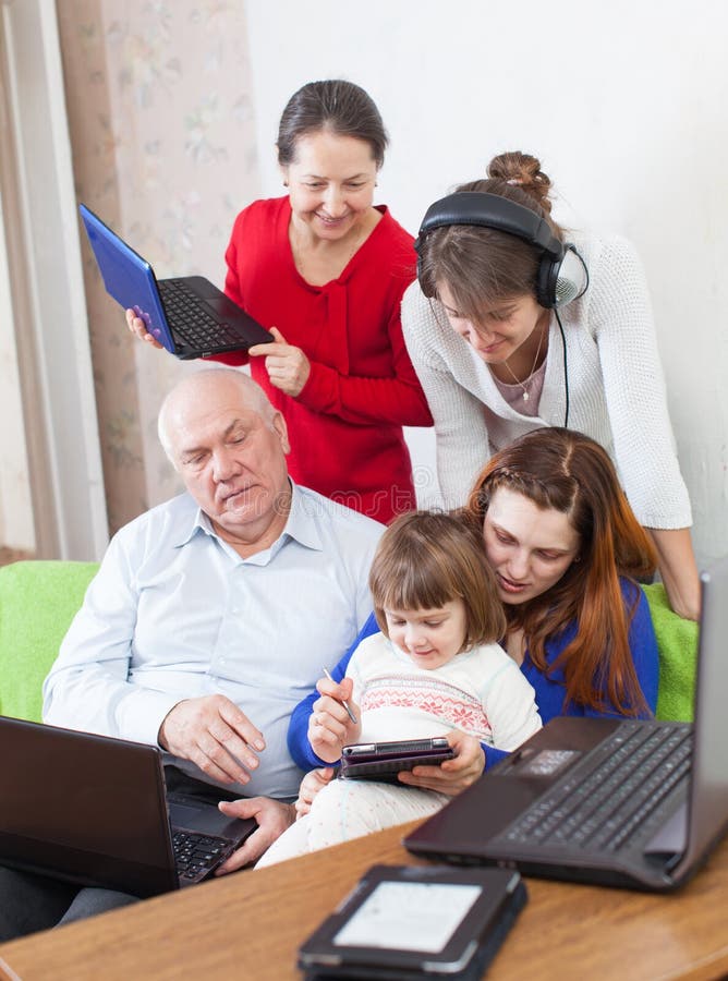Happy Family Uses Few Electronic Devices Stock Image - Image of ...