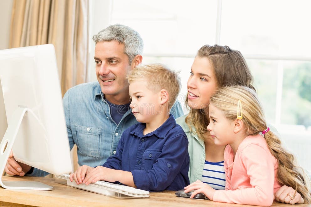 Happy Family Using the Computer Stock Photo - Image of domicile ...