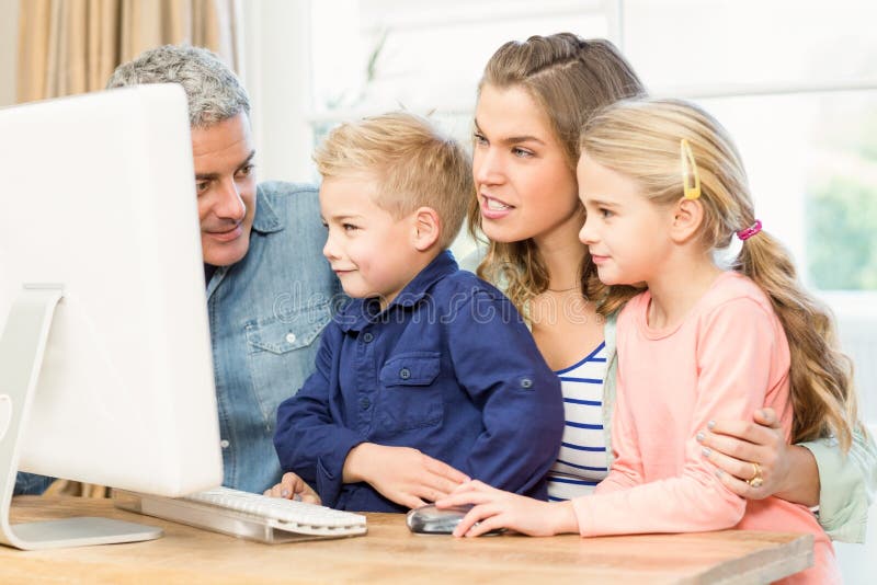 Happy Family Using the Computer Stock Photo - Image of happiness ...