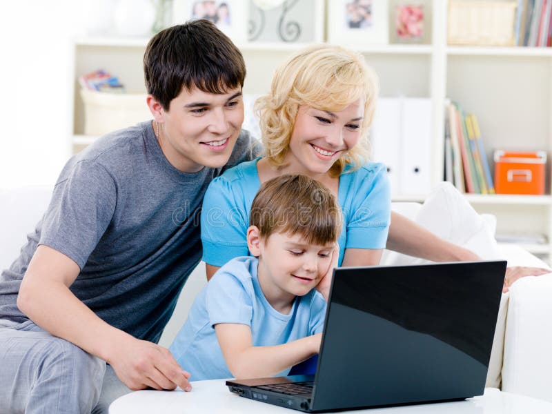 Family Group Using Computer Together Stock Photo - Image of sister ...