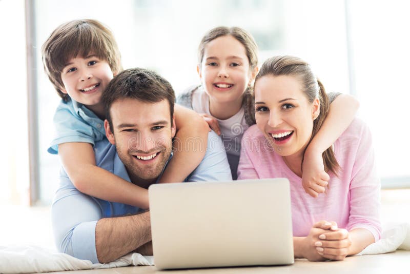 Family Group Using Computer Together Stock Photo - Image of sister ...