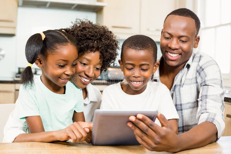 Happy Family Using Tablet in Kitchen Stock Image - Image of daughter ...