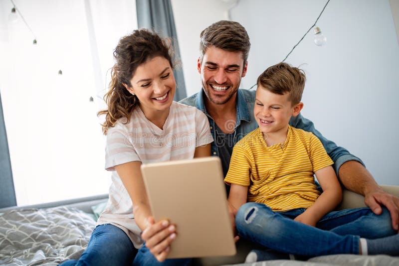 Happy Family Using Technology Devices Together at Home. Stock Image ...