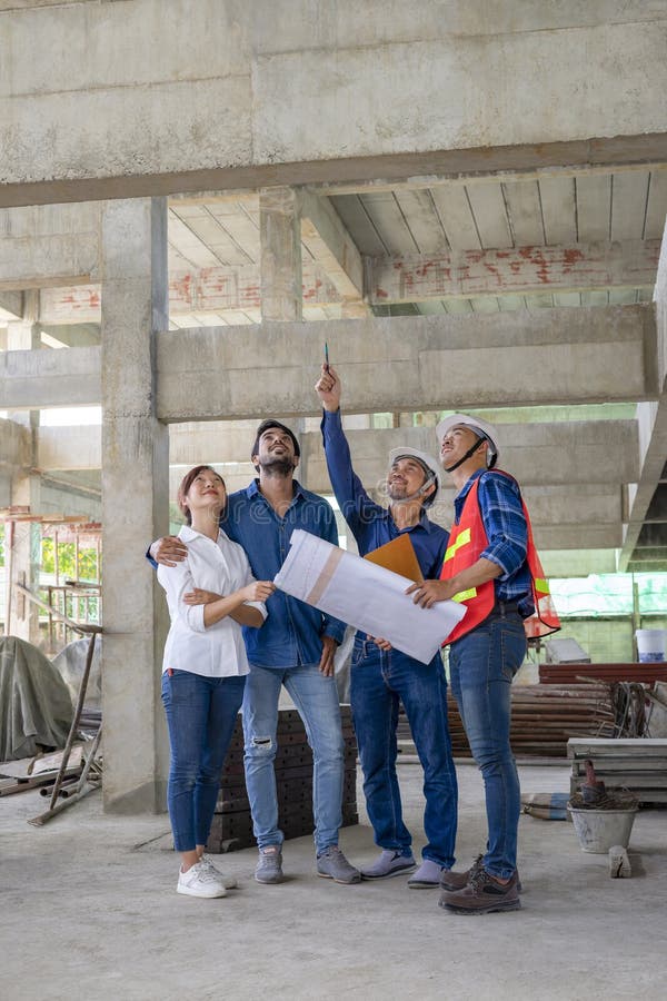 Happy Family Visiting and Talking To Contractor at Site Stock Photo ...