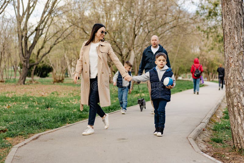 Happy Family on a Walk in the Park Stock Image - Image of walk ...