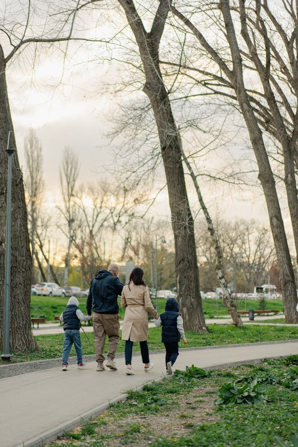 Happy Family on a Walk in the Park Stock Image - Image of smiling ...