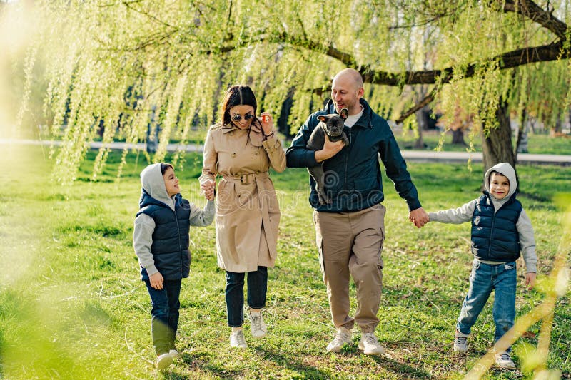 Young Woman with Her French Bulldog Puppy on a Walk in the Park Stock ...