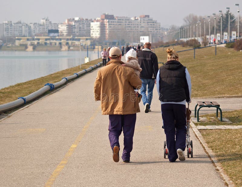 Happy Family Walking on Promenade Stock Photo - Image of people, shore ...