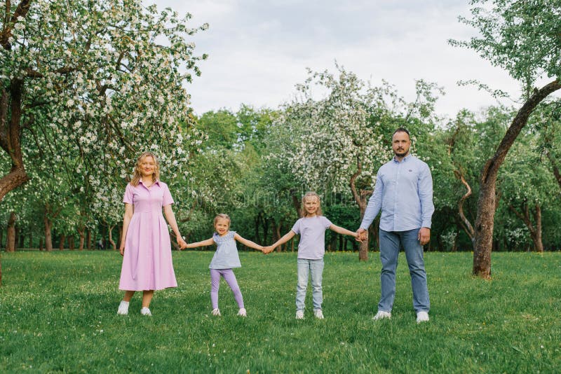 Happy Family Walks in the Park in the Spring Stock Photo - Image of ...