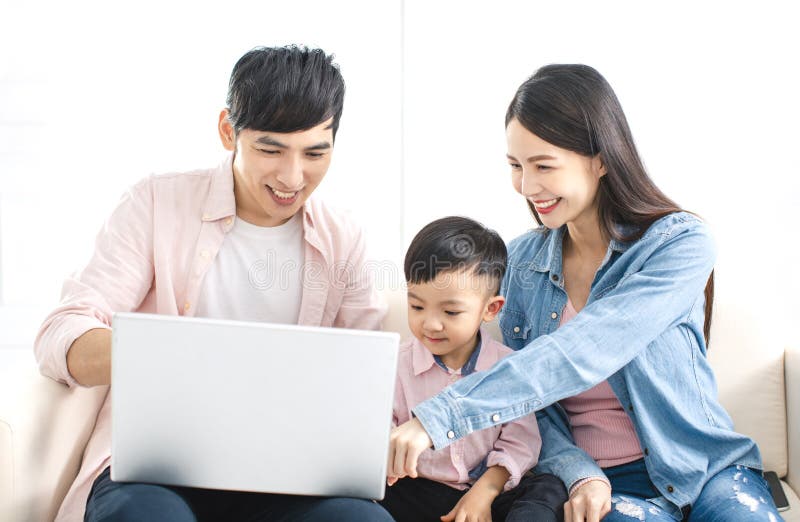 Happy Family Watching the Laptop on Sofa Stock Photo - Image of mobile ...