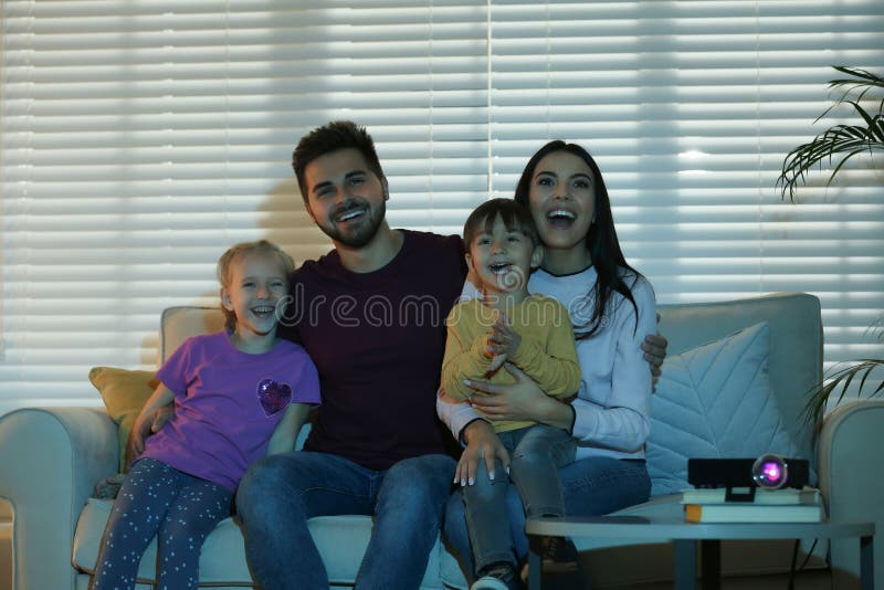 Happy Family Watching Movie Using Video Projector Stock Image - Image ...