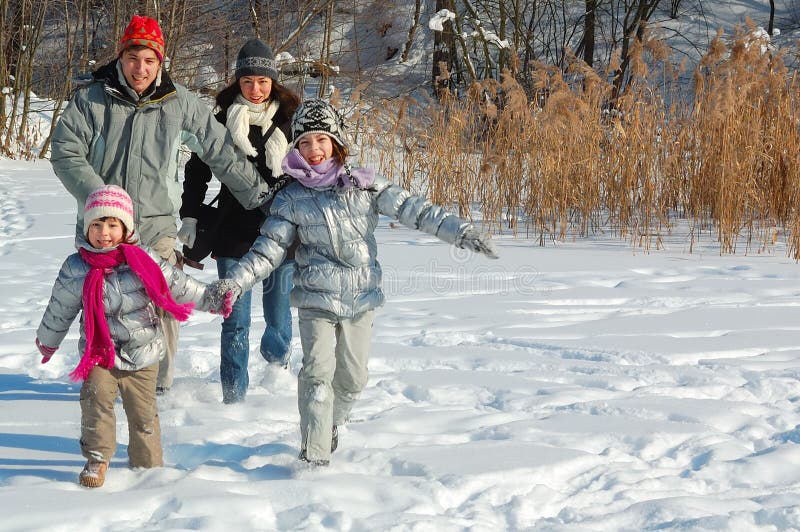 Happy Family in Winter, Having Fun with Snow Outdoors Stock Image ...