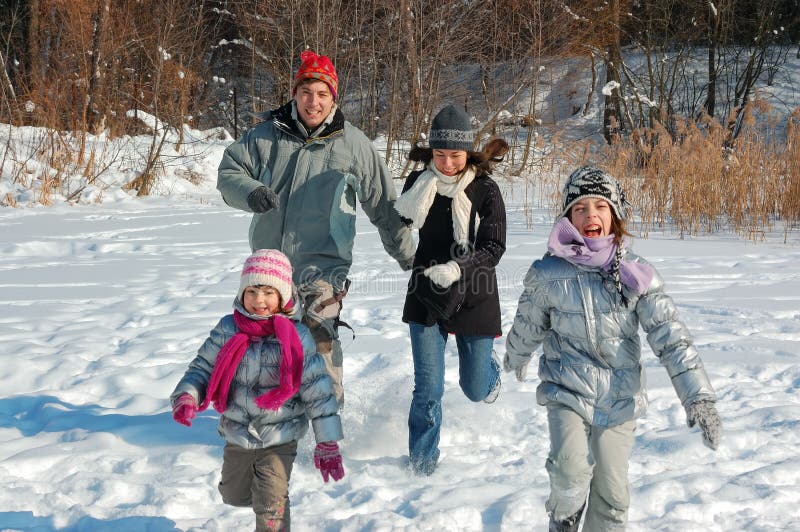 Happy Family in Winter, Having Fun with Snow Outdoors Stock Photo ...