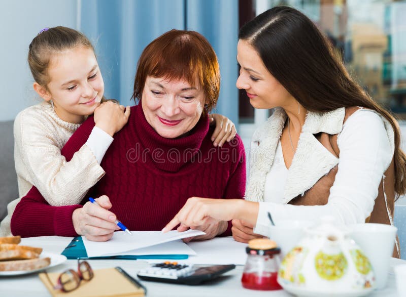 Happy Family Working with Documents at Home Stock Image - Image of ...