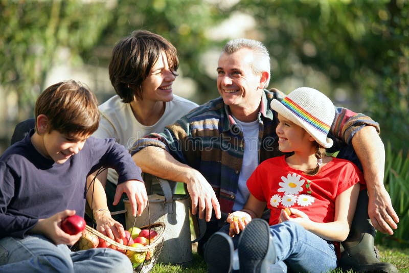Happy family in a yard stock image. Image of family, countryside - 14489439