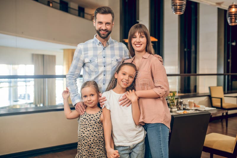 Young Sweet Family Standing and Looking Happy Stock Image - Image of ...
